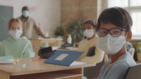 Asian Schoolboy in Face Mask Posing for ... | Stock Video | Pond5