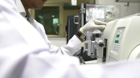 Asian scientist cut sample for experimen... | Stock Video | Pond5