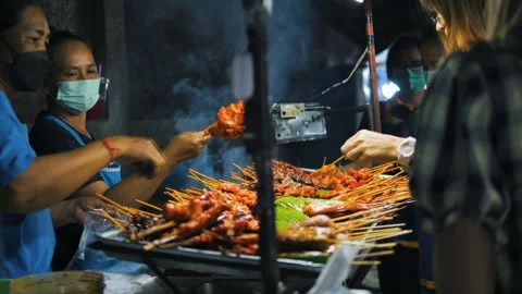 Asian street food: chef cooking and sell... | Stock Video | Pond5