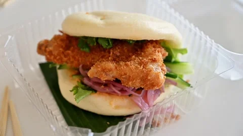 Asian street food takeout. Bao bun with ... | Stock Video | Pond5