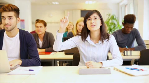 asian student raising hand in classroom | Stock Video | Pond5