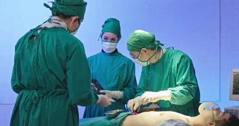 asian team of surgeons is performing an ... | Stock Video | Pond5