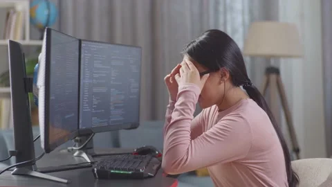 Asian Teen Girl Programmer Having A Head... | Stock Video | Pond5