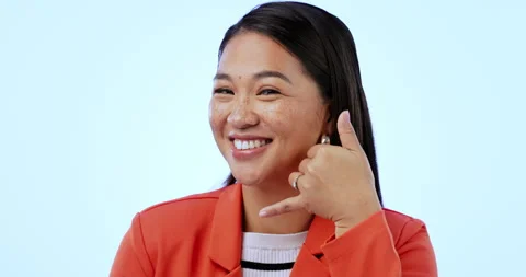 Asian woman, call me sign and studio wit... | Stock Video | Pond5