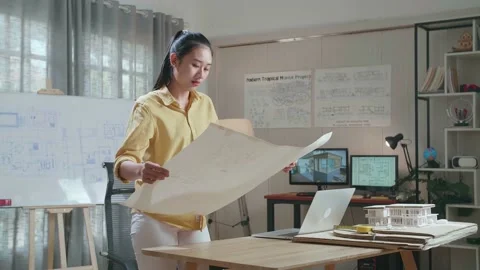 Asian Woman Engineer With A Laptop Looki... | Stock Video | Pond5