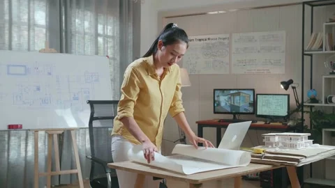 Asian Woman Engineer With A Laptop Looki... | Stock Video | Pond5