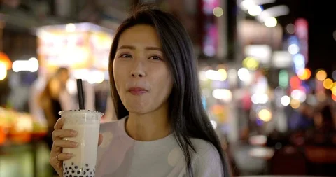 Asian woman enjoy bubble milk tea with s... | Stock Video | Pond5