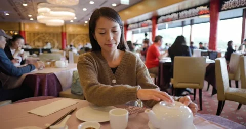 Asian woman enjoy dim sum in Chinese res... | Stock Video | Pond5