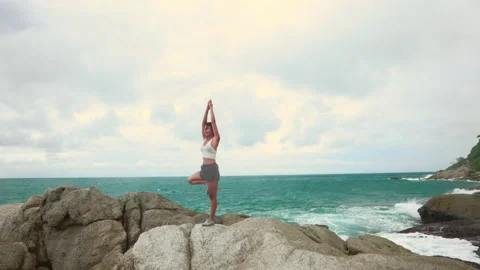 Asian woman improves balance for body, m... | Stock Video | Pond5