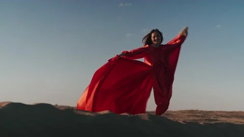 An Asian woman in a red dress gets into ... | Stock Video | Pond5