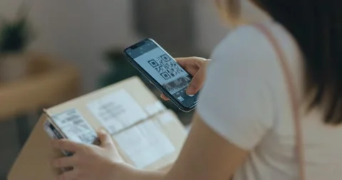 Asian woman scanning QR code of parcel. | Stock Video | Pond5