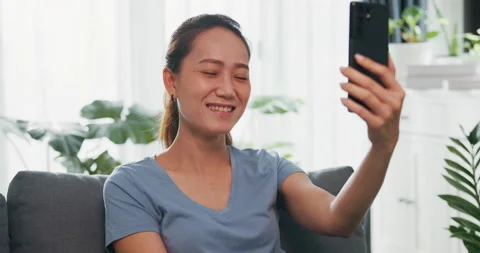 Asian woman use smartphone raise hand vi... | Stock Video | Pond5