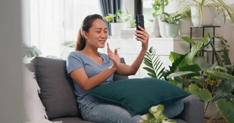 Asian woman use smartphone raise hand vi... | Stock Video | Pond5