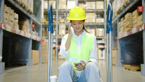 Asian woman worker listening to music us... | Stock Video | Pond5
