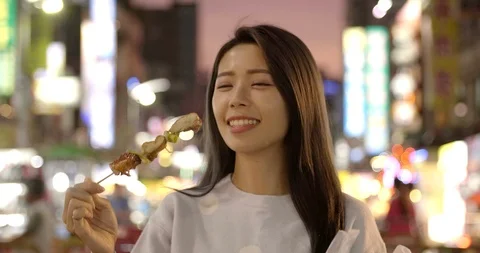 Asian young woman enjoy street food in ... | Stock Video | Pond5