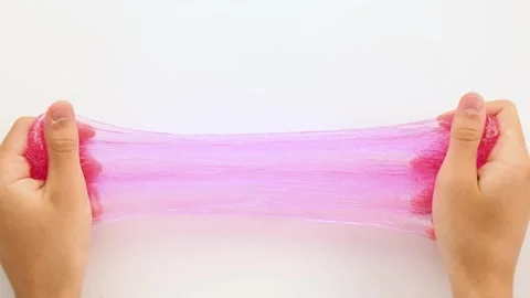 Asmr. The boy's hands stretch the pink, ... | Stock Video | Pond5