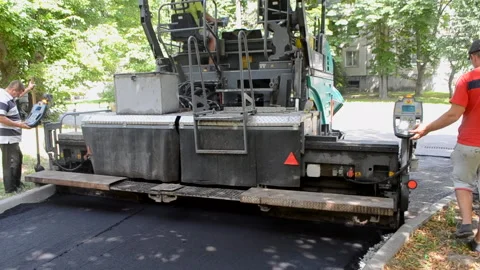 Asphalt paving machine, people. Paver, p... | Stock Video | Pond5