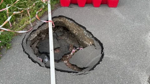 Asphalt sidewalk collapsed large hole pl... | Stock Video | Pond5