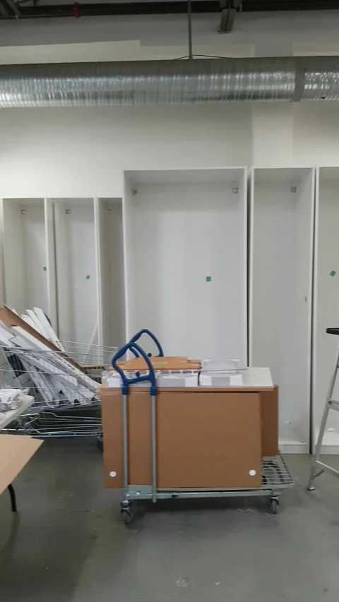 Assembling IKEA PAX Units in Warehouse | Stock Video | Pond5