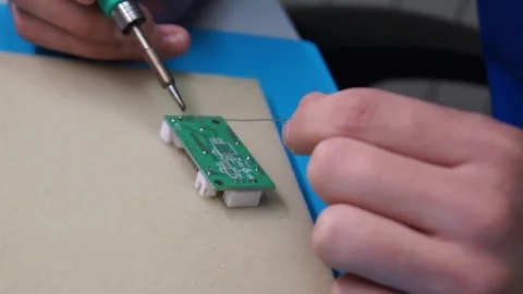 Assembling a microcircuit using a solder... | Stock Video | Pond5