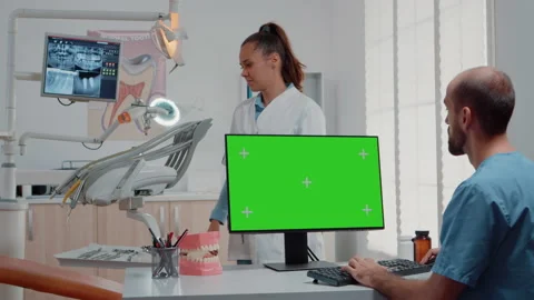 Assistant using horizontal green screen ... | Stock Video | Pond5