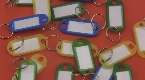 Assorted coloured key tags rotating on ... | Stock Video | Pond5
