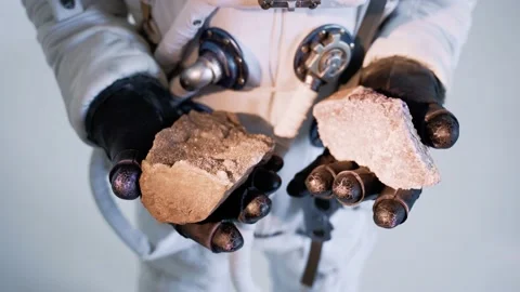 astronaut holding stones, minerals close... | Stock Video | Pond5
