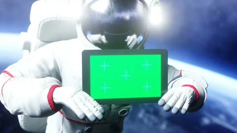 Astronaut in space with tablet, monitor.... | Stock Video | Pond5