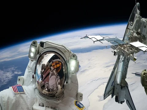 Astronaut Spacewalk with Space Shuttle o... | Stock Video | Pond5