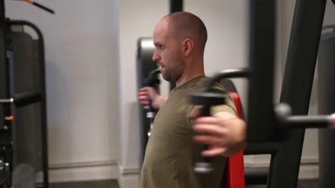 Athlete bodybuilder pumping muscles in t... | Stock Video | Pond5