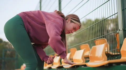 Athlete Cleaning Yellow Stadium Seat wit... | Stock Video | Pond5