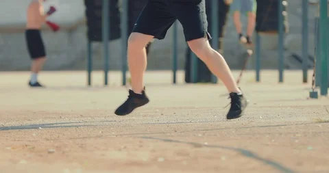 Athlete trains leg technique on a street... | Stock Video | Pond5