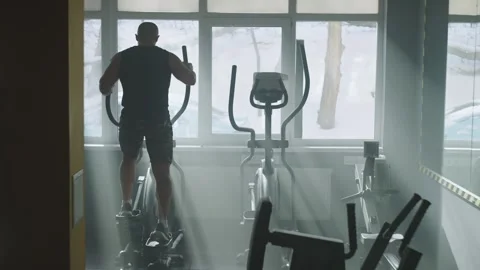 The athlete works out on the orbit track... | Stock Video | Pond5