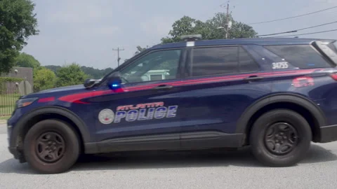 Atlanta Police Car driving past jail | Stock Video | Pond5