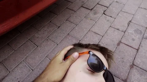 Attractive fainted guy is lying on concr... | Stock Video | Pond5