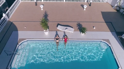 attractive Friends girl into Swimsuit re... | Stock Video | Pond5