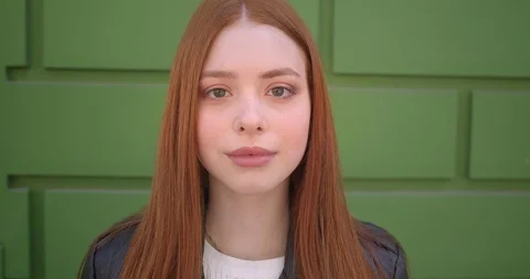 Attractive ginger girl in leather jacket... | Stock Video | Pond5