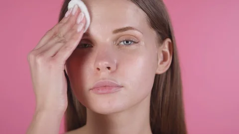 Attractive Young Woman Wiping Face with ... | Stock Video | Pond5