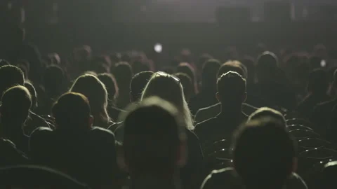 Audience silhouettes in beams of stage l... | Stock Video | Pond5