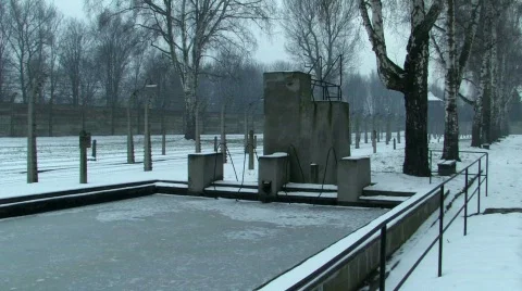 Auschwitz 1 swimming pool forzen over wi... | Stock Video | Pond5