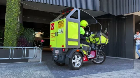 Australia post postman driving battery-o... | Stock Video | Pond5