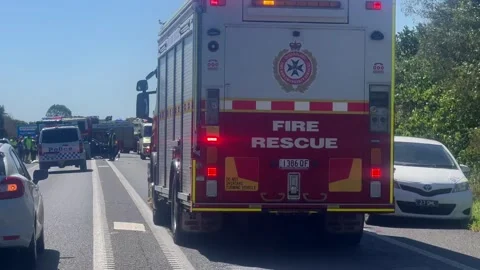 Australian Fire Rescue Forces in car acc... | Stock Video | Pond5