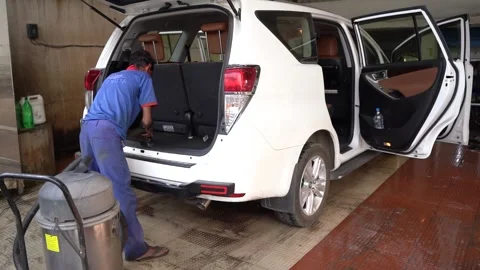 Auto mechanic working in a Indian garage | Stock Video | Pond5
