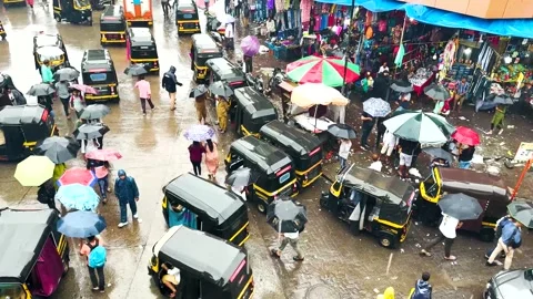Auto rickshaws and pedestrians in heavy ... | Stock Video | Pond5