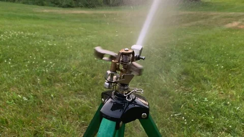 Automatic Sprinkler System Watering Gras... | Stock Video | Pond5