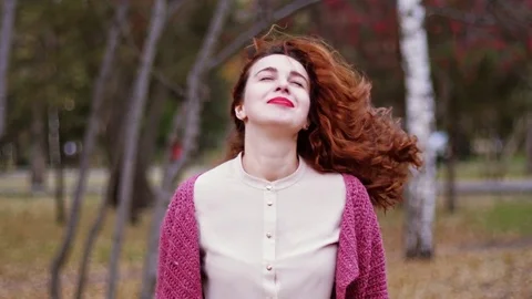 Autumn woman in fall forest looking at c... | Stock Video | Pond5