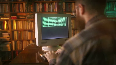 Awkward hacker guy breaching computer sy... | Stock Video | Pond5