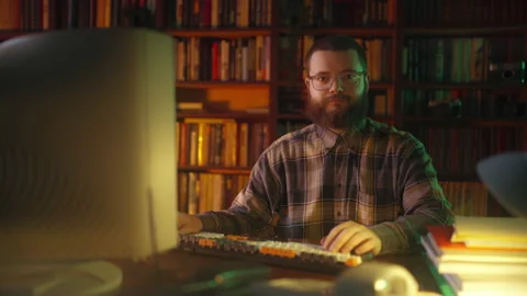 Awkward nerdy guy working in retro offic... | Stock Video | Pond5