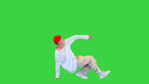 B-boy is dancing break dance on a Green ... | Stock Video | Pond5