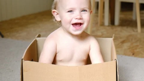 Baby in the Box. Pretty baby infant girl... | Stock Video | Pond5